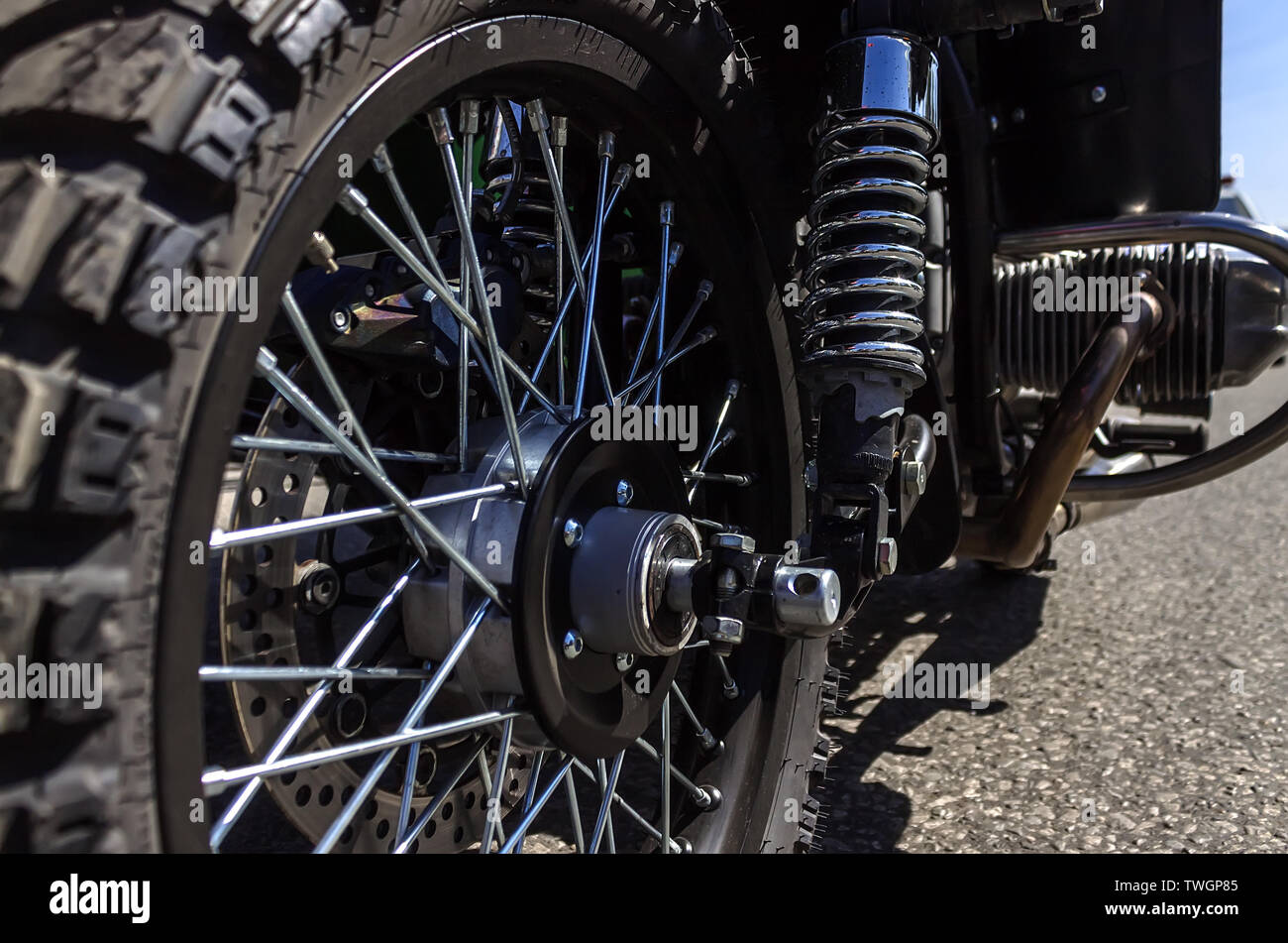 The front wheel of the motorcycle with spokes and reinforcement spring ...