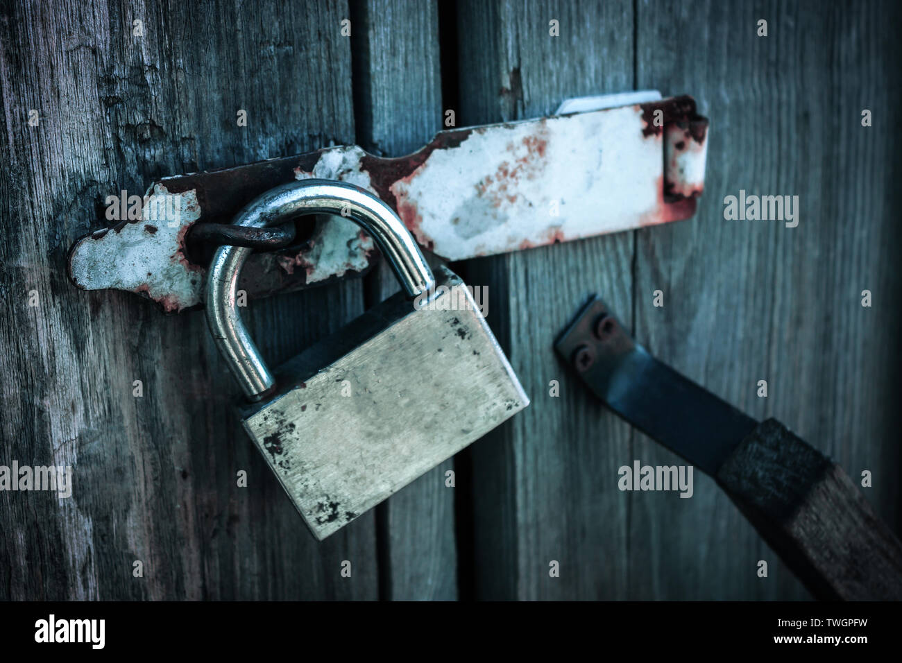 Hanging castle on the doors of an abandoned old barn in the style of ...
