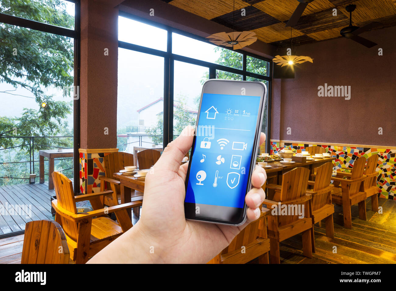 smart phone with smart home with modern restaurant Stock Photo - Alamy
