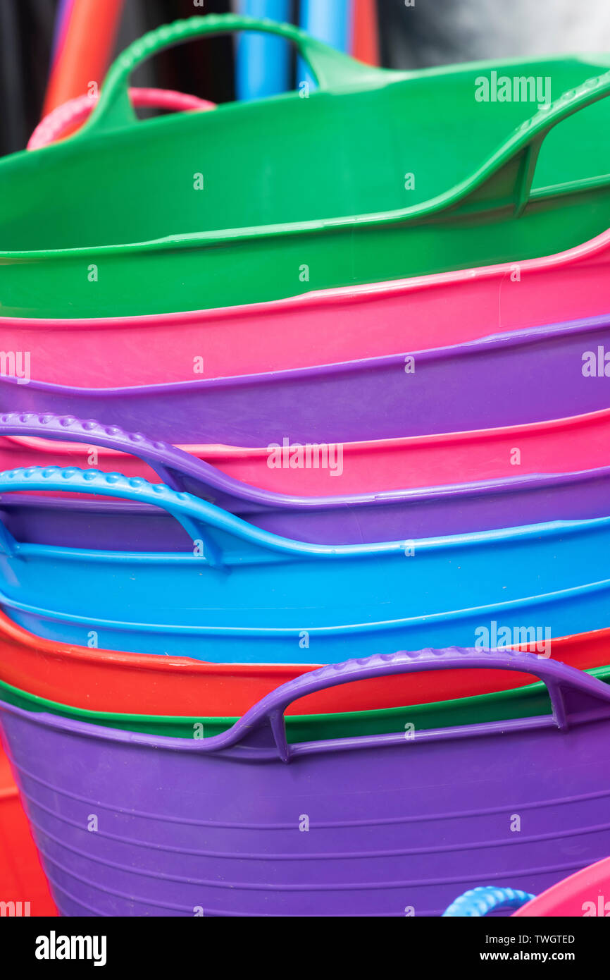 Colourful plastic garden trugs at a flower show. UK Stock Photo - Alamy