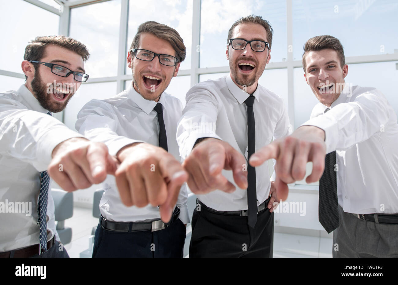 happy employees pointing at you Stock Photo - Alamy