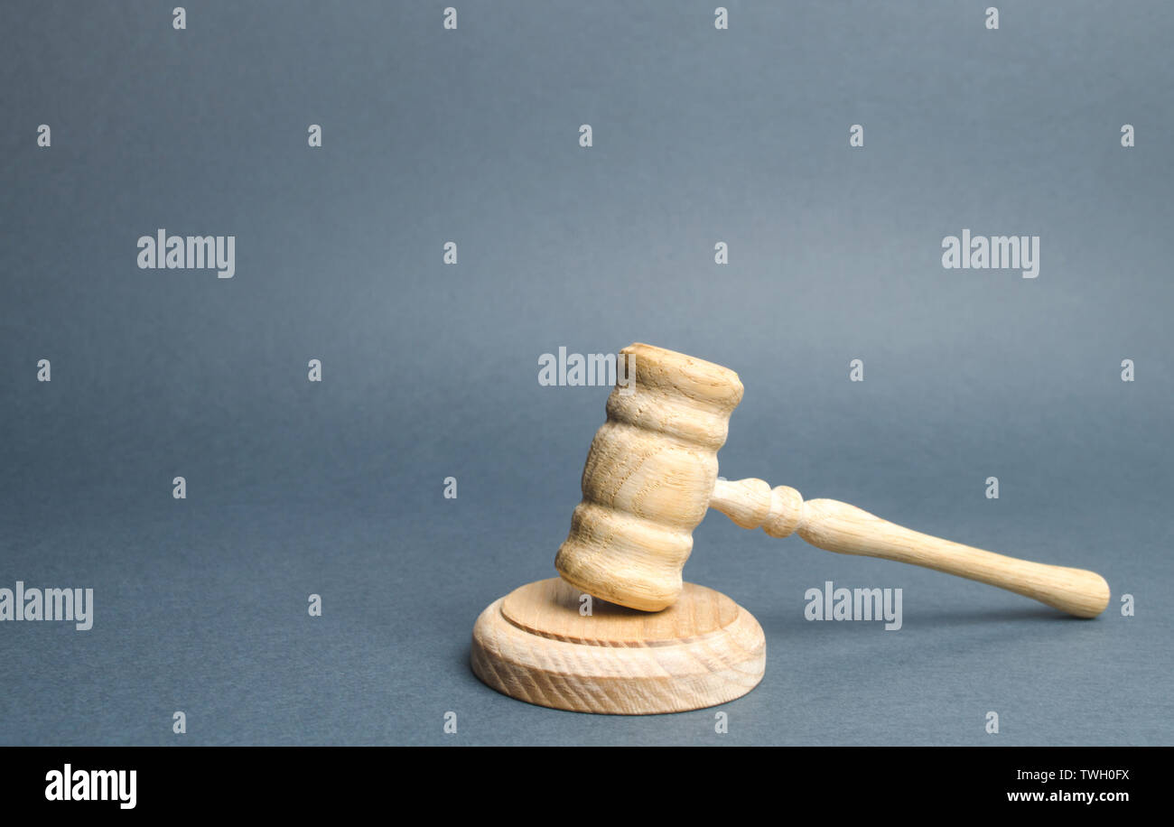 Judge's hammer on a gray background. The judicial system. Norms, rules ...