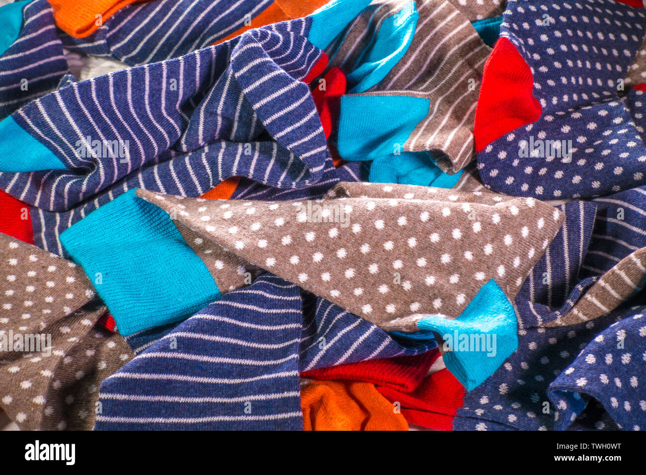 Multiple pairs of clean socks, jumbled up after washing, of varying ...