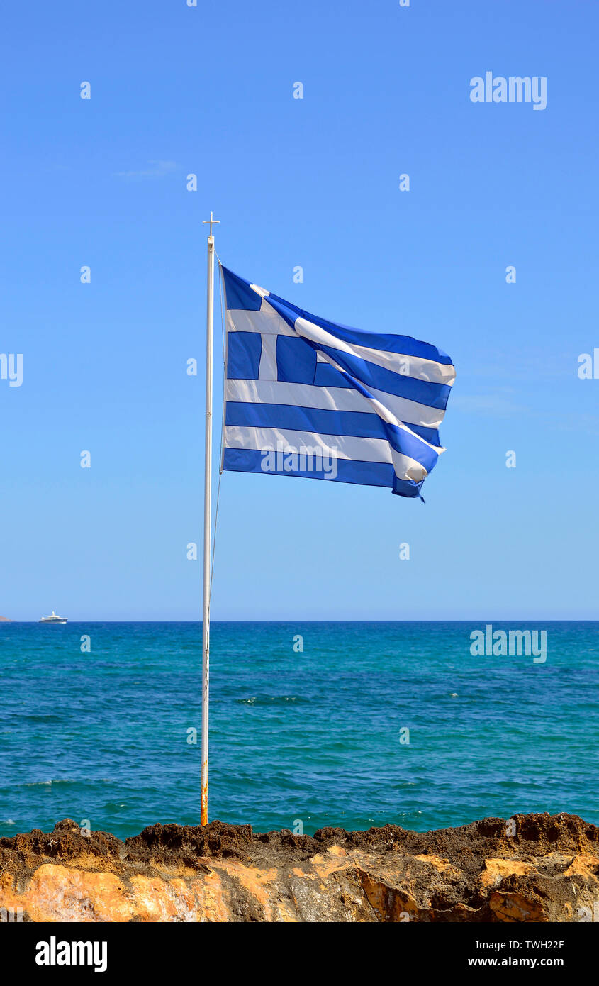 Greece flag flying in the Greek island Crete Stock Photo - Alamy