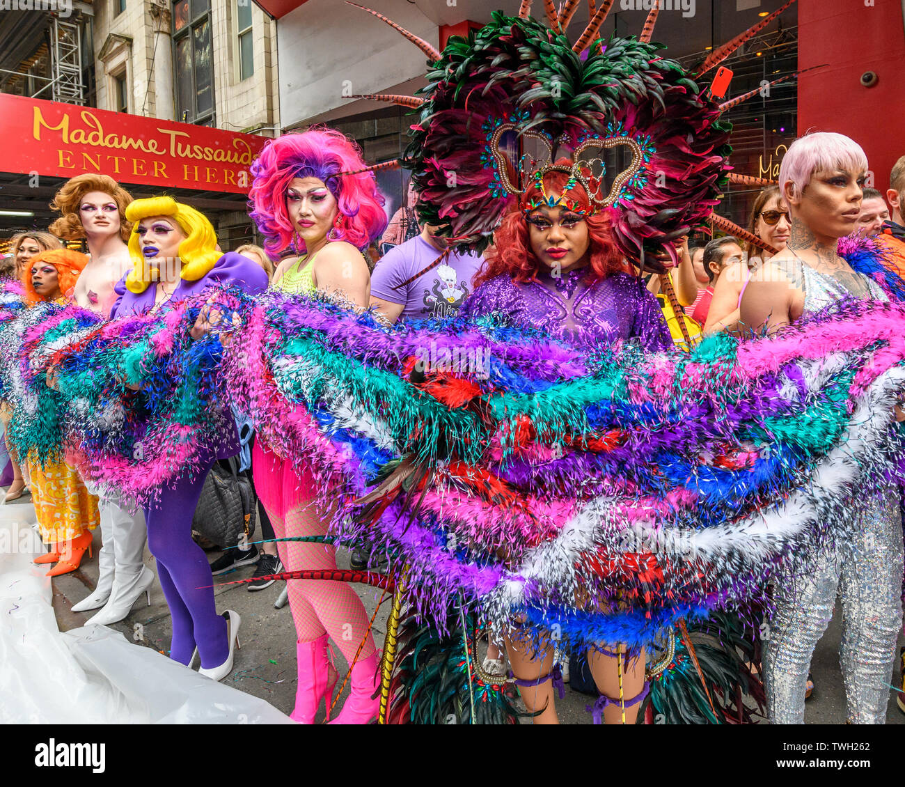 New York, USA, 20 June 2019. Drag queens carry the longest feather boa ...