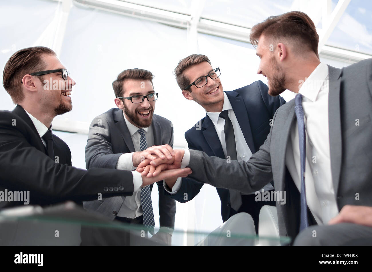 Man sitting hand folding hi-res stock photography and images - Alamy
