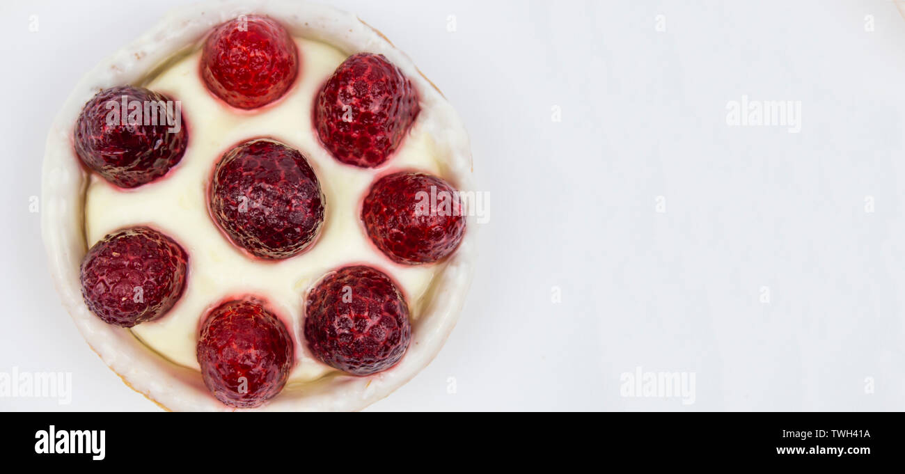 Raspberry birthday cake on a white background, top view, copy space ...