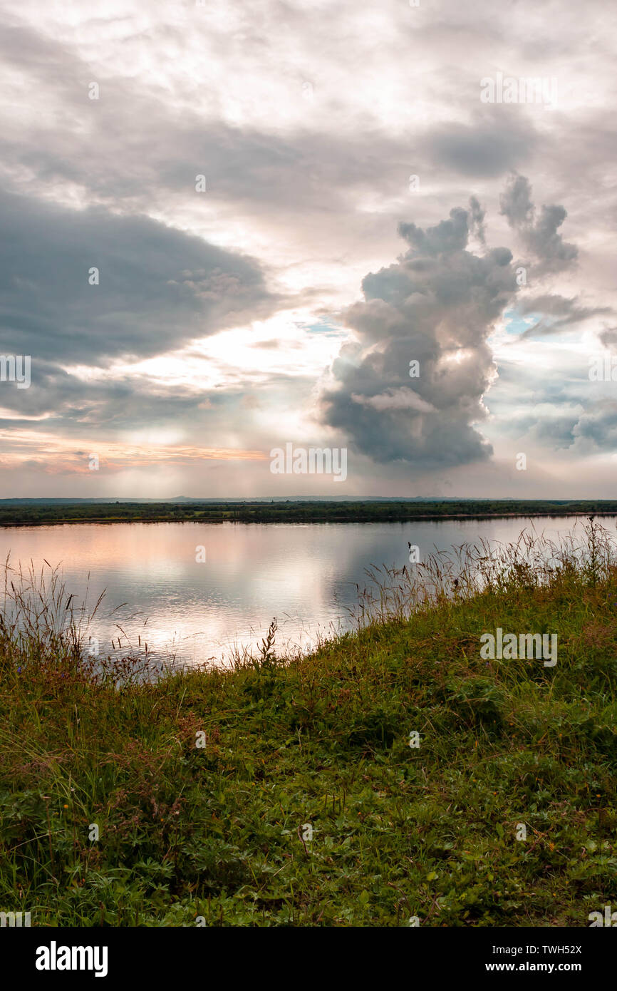 Dramatic Beautiful pink blue orange twilight sunset over the river with ...