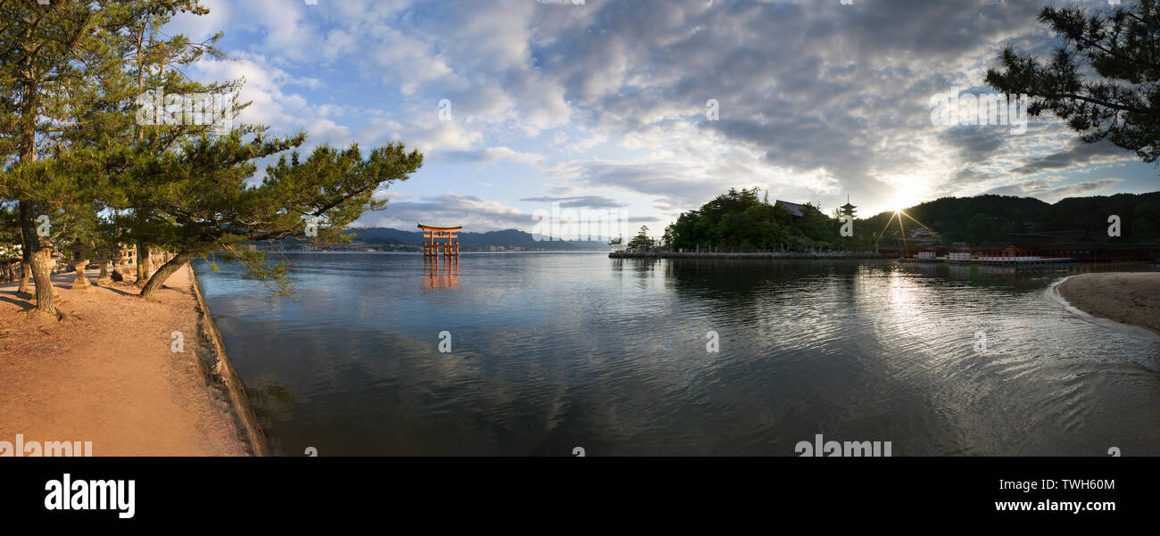 Sunset panorama of floating torii on Miyajima Island, Japan Stock Photo ...
