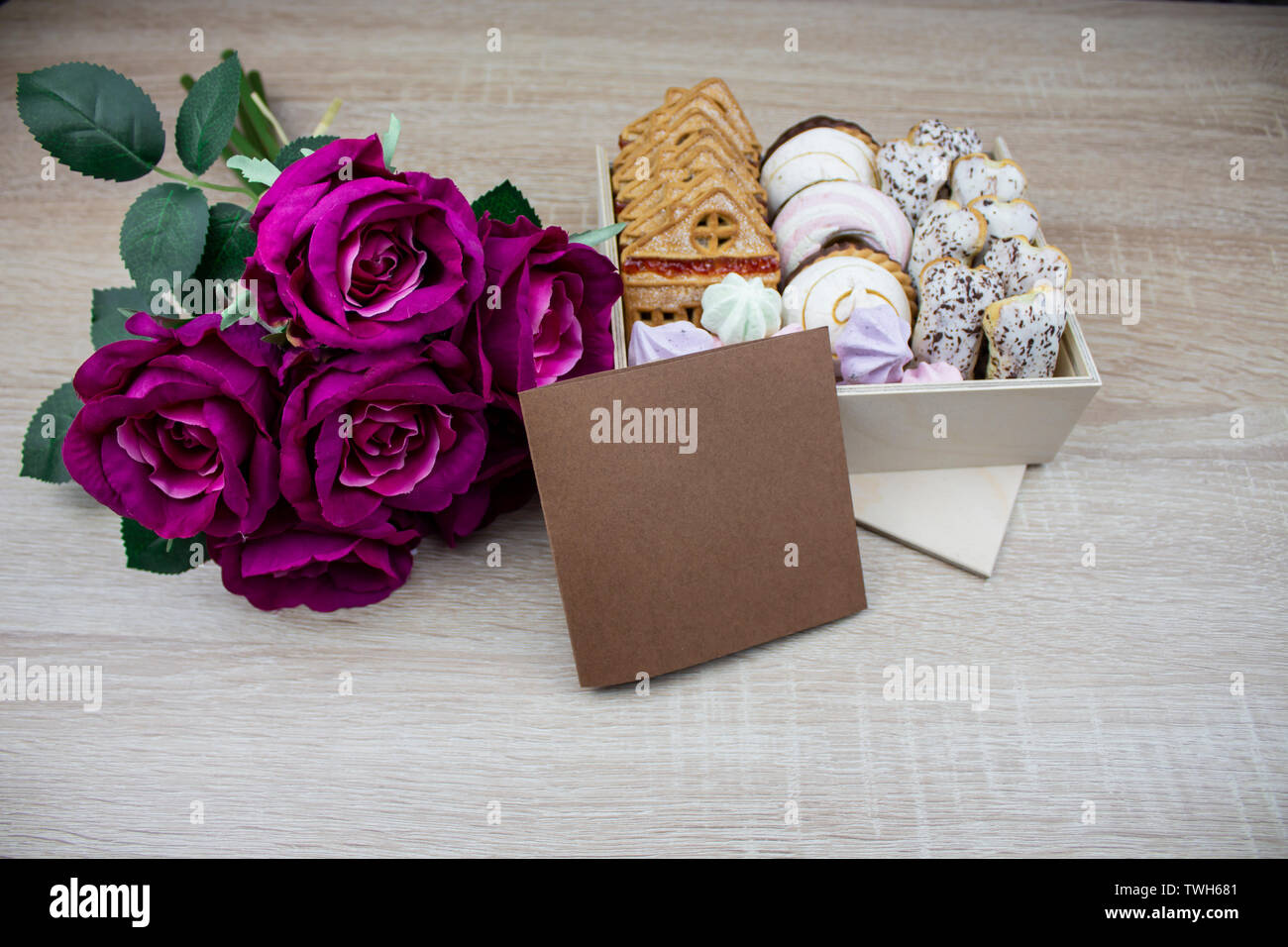 Chocolate cookies on a wooden table. A variety of cookies in a box with ...