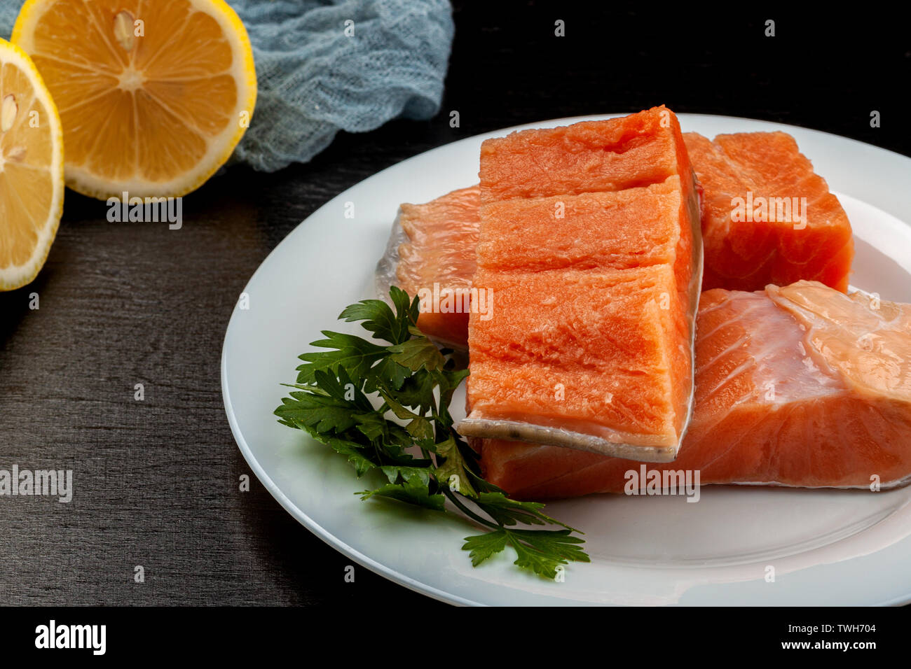 On the table soit dish with red trout fillet Stock Photo - Alamy