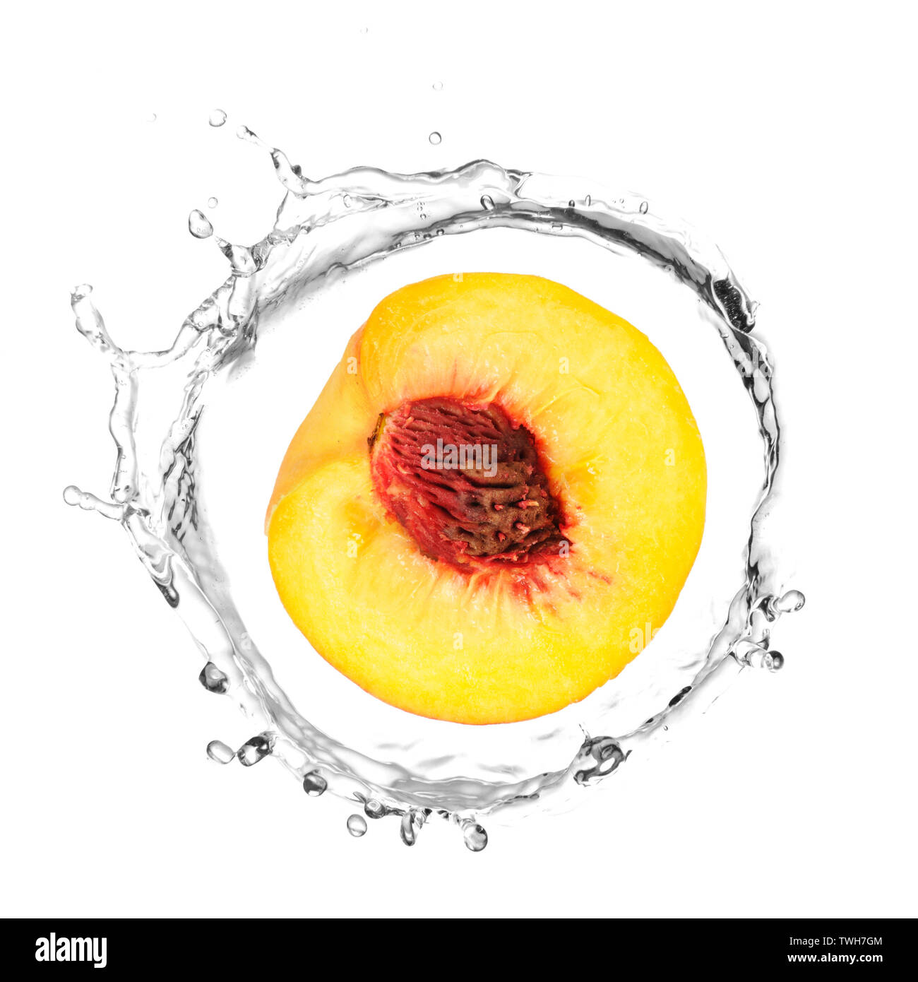 Half of yellow peach in water splash Stock Photo - Alamy