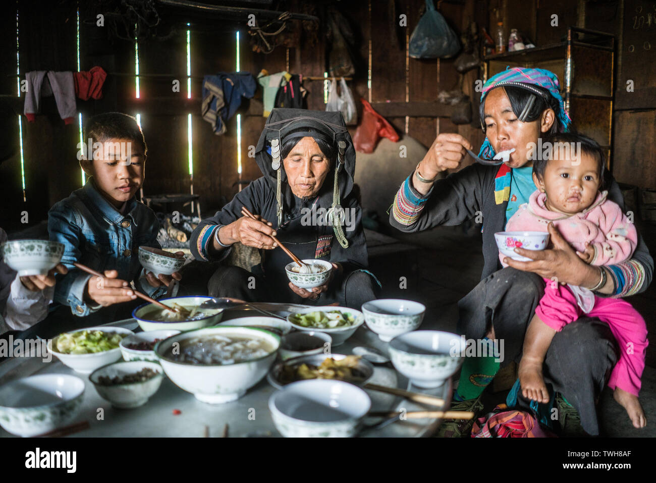 women Akha Pixor ethnicity and their childrens have lunch in the ...