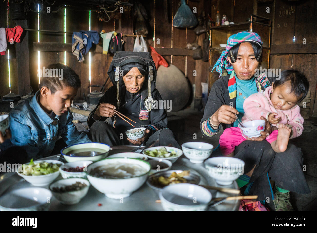 women Akha Pixor ethnicity and their childrens have lunch in the ...