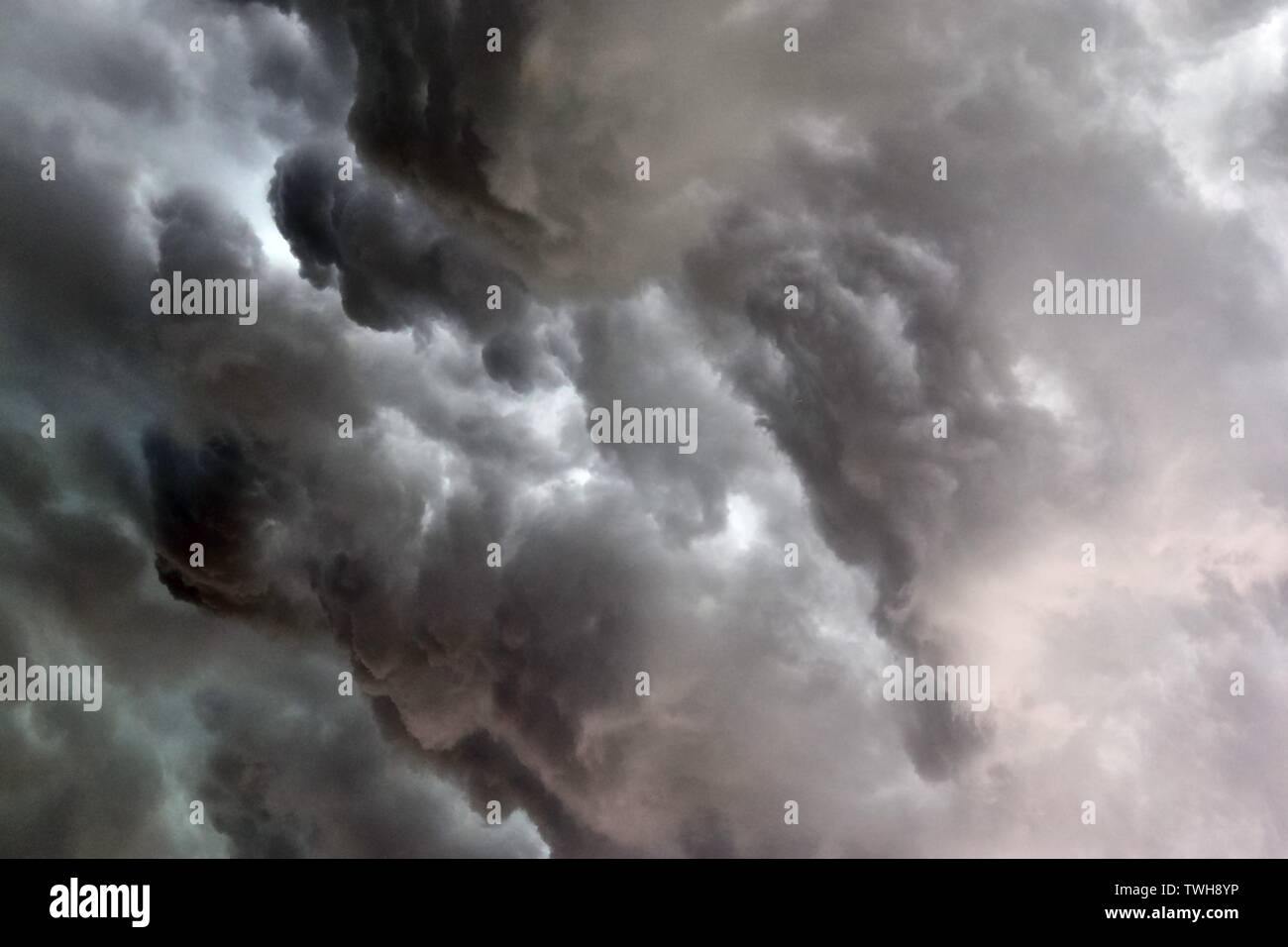 Very dark cloud formations of a heavy thunderstorm during sunset Stock ...