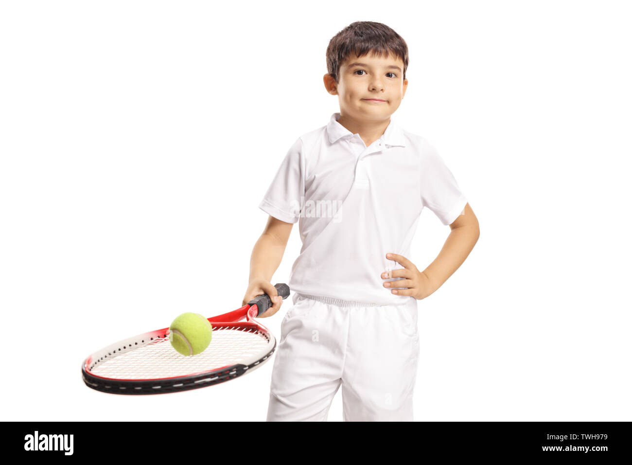 Boy holding a tennis ball on a racquet isolated on white background ...