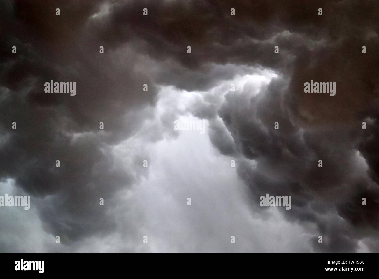 Very dark cloud formations of a heavy thunderstorm during sunset Stock ...