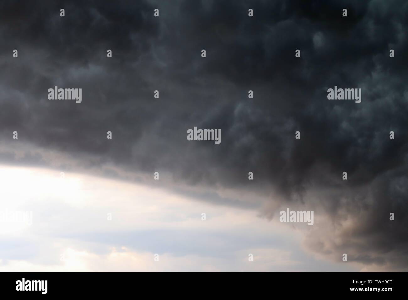 Very dark cloud formations of a heavy thunderstorm during sunset Stock ...