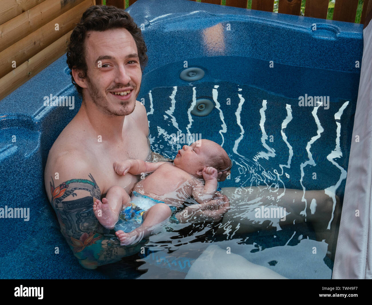 Newborn Baby in Bath with Parent Stock Photo - Alamy