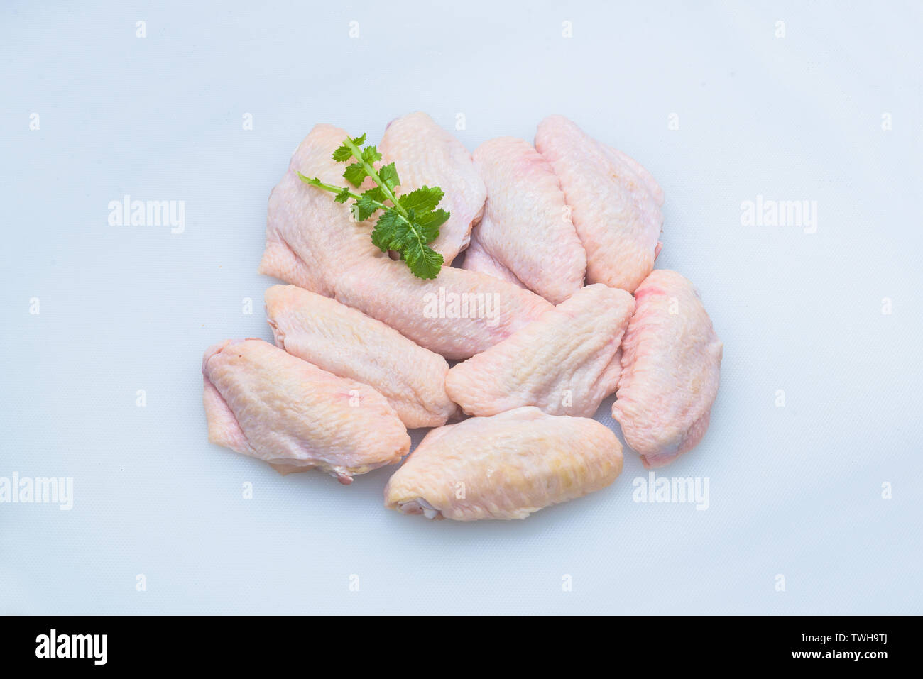 Chicken middle wings on a white background, fresh food Stock Photo - Alamy