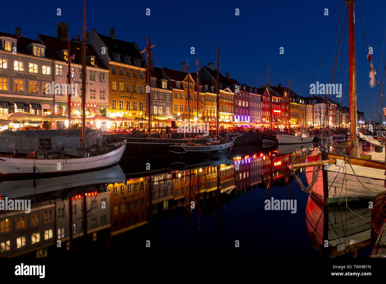 Copenhagen, Denmark: April 18, 2019: Illuminated houses and ships at ...