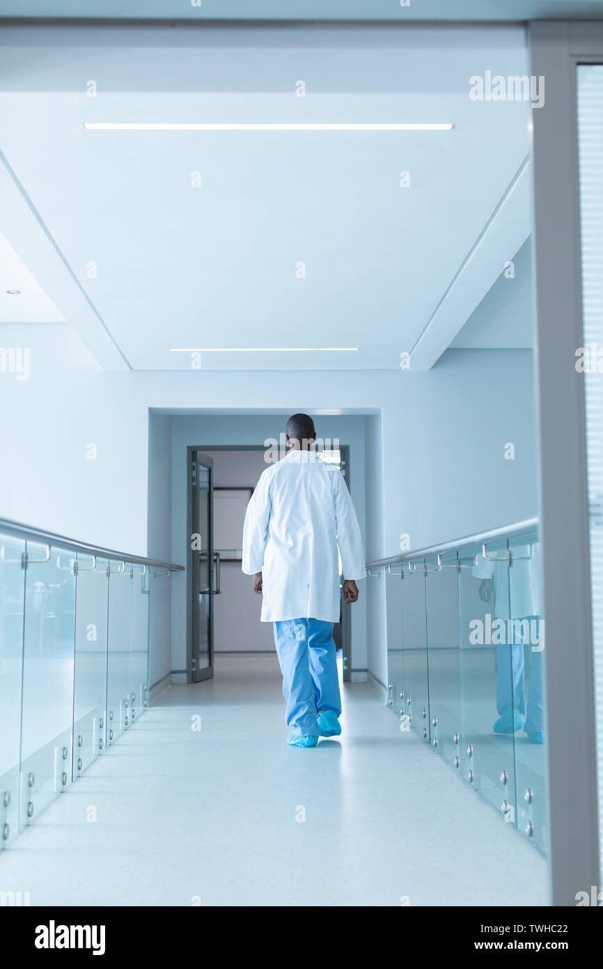 Black doctor walking hi-res stock photography and images - Alamy