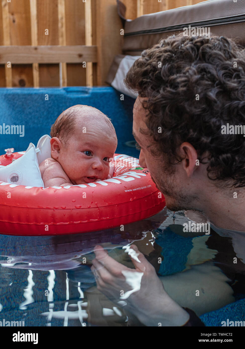 Newborn Baby in Bath with Parent Stock Photo - Alamy
