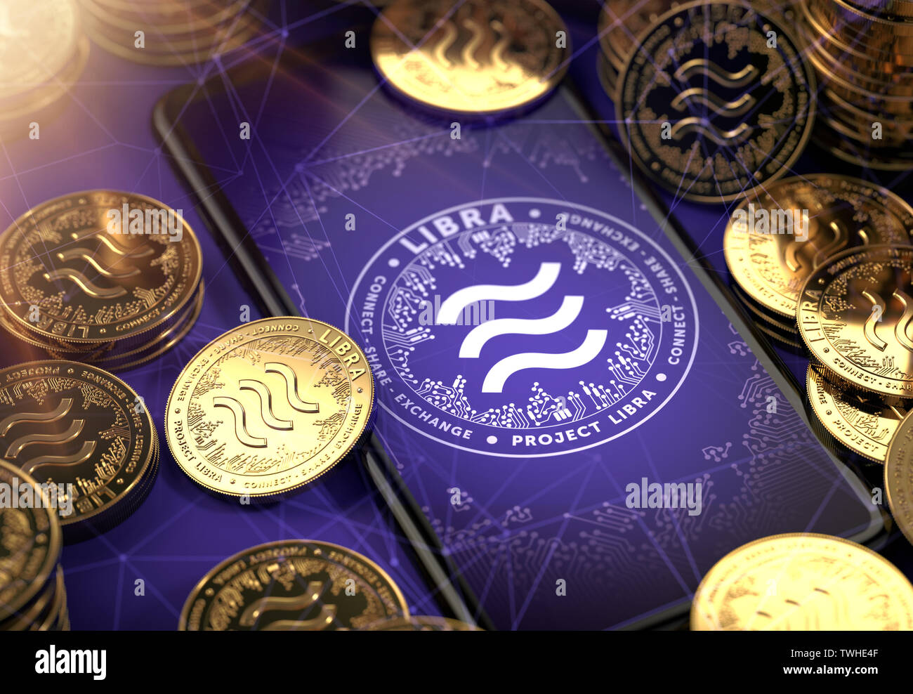 Smartphone with Libra concept coin design on-screen among piles of ...