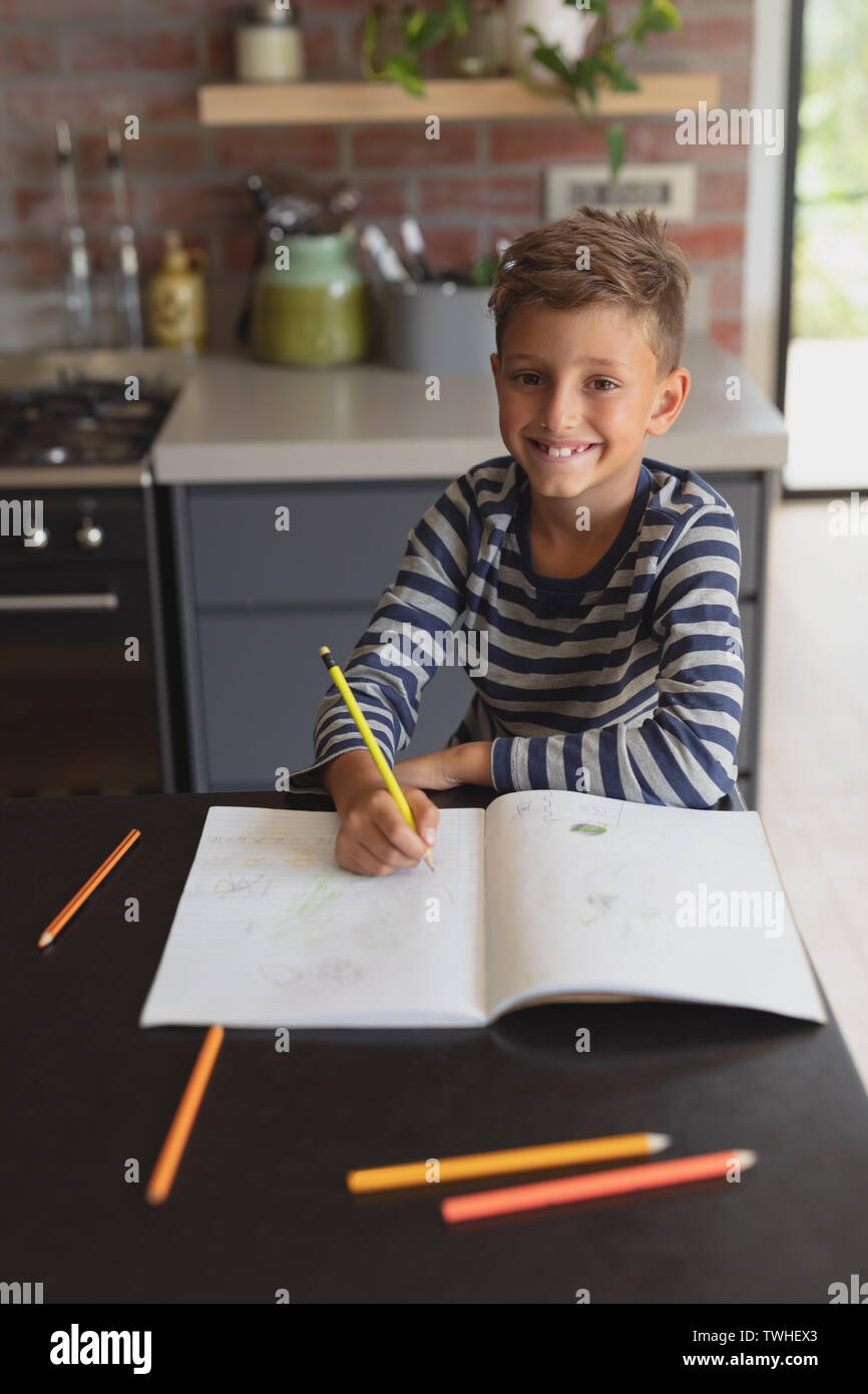 Boy studying table in kitchen hi-res stock photography and images - Alamy