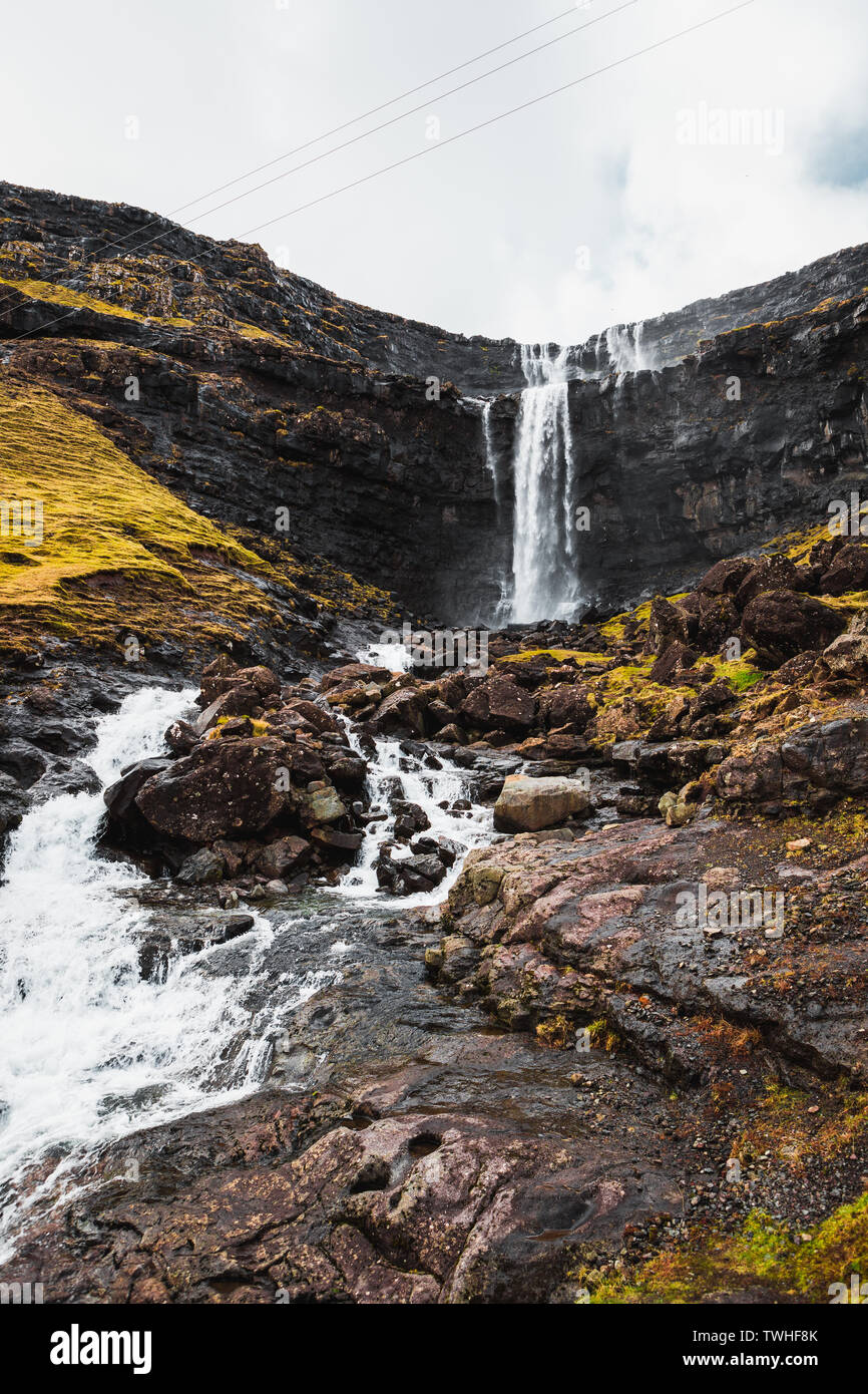 Fossa, the largest waterfall on the Faroe Islands, as seen during early ...