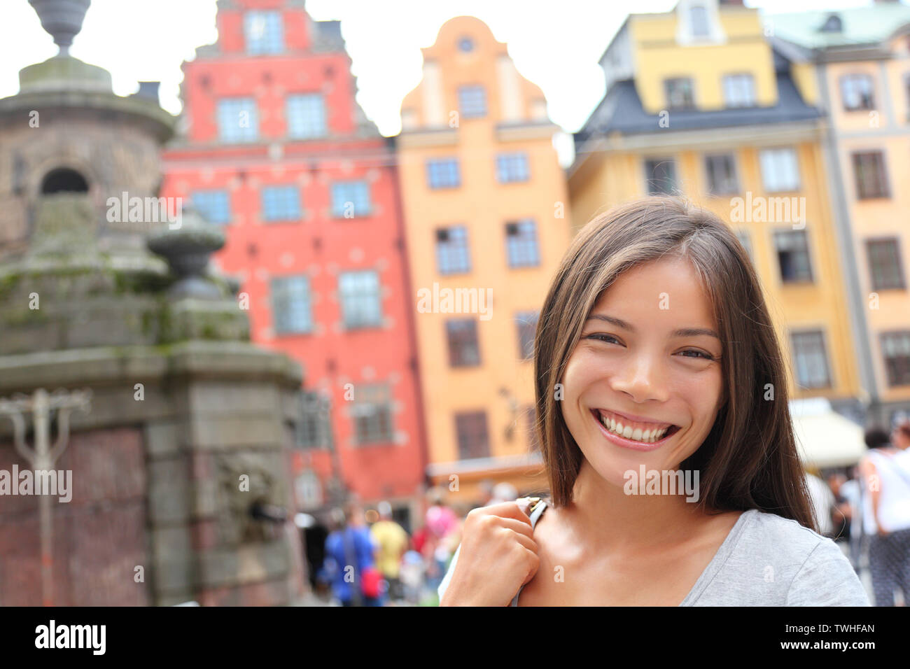 Woman portrait in Europe, Stortorget, Stockholm, Sweden. Happy candid ...