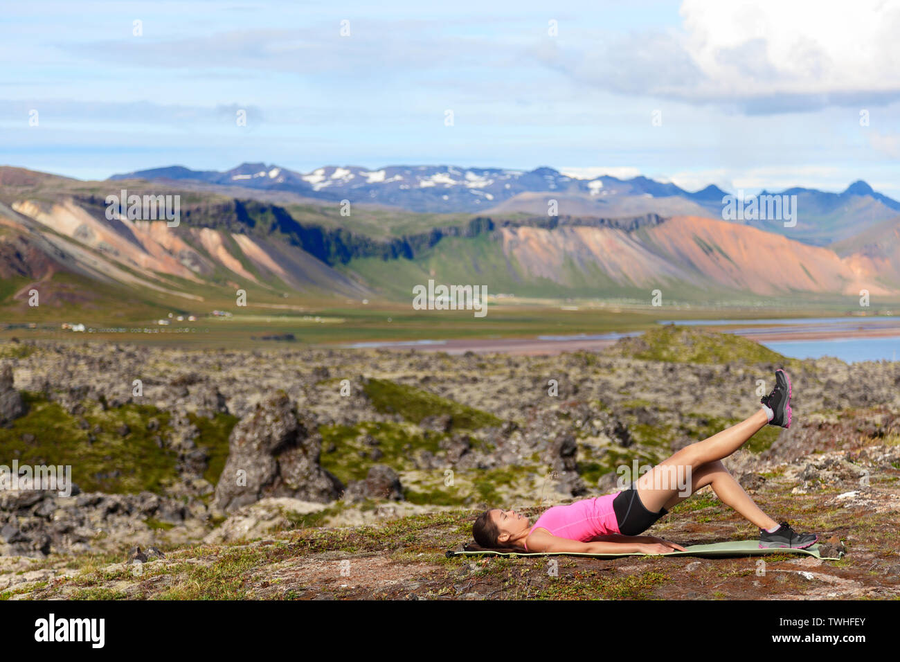 Fitness woman exercising single leg glute bridge exercise training butt ...