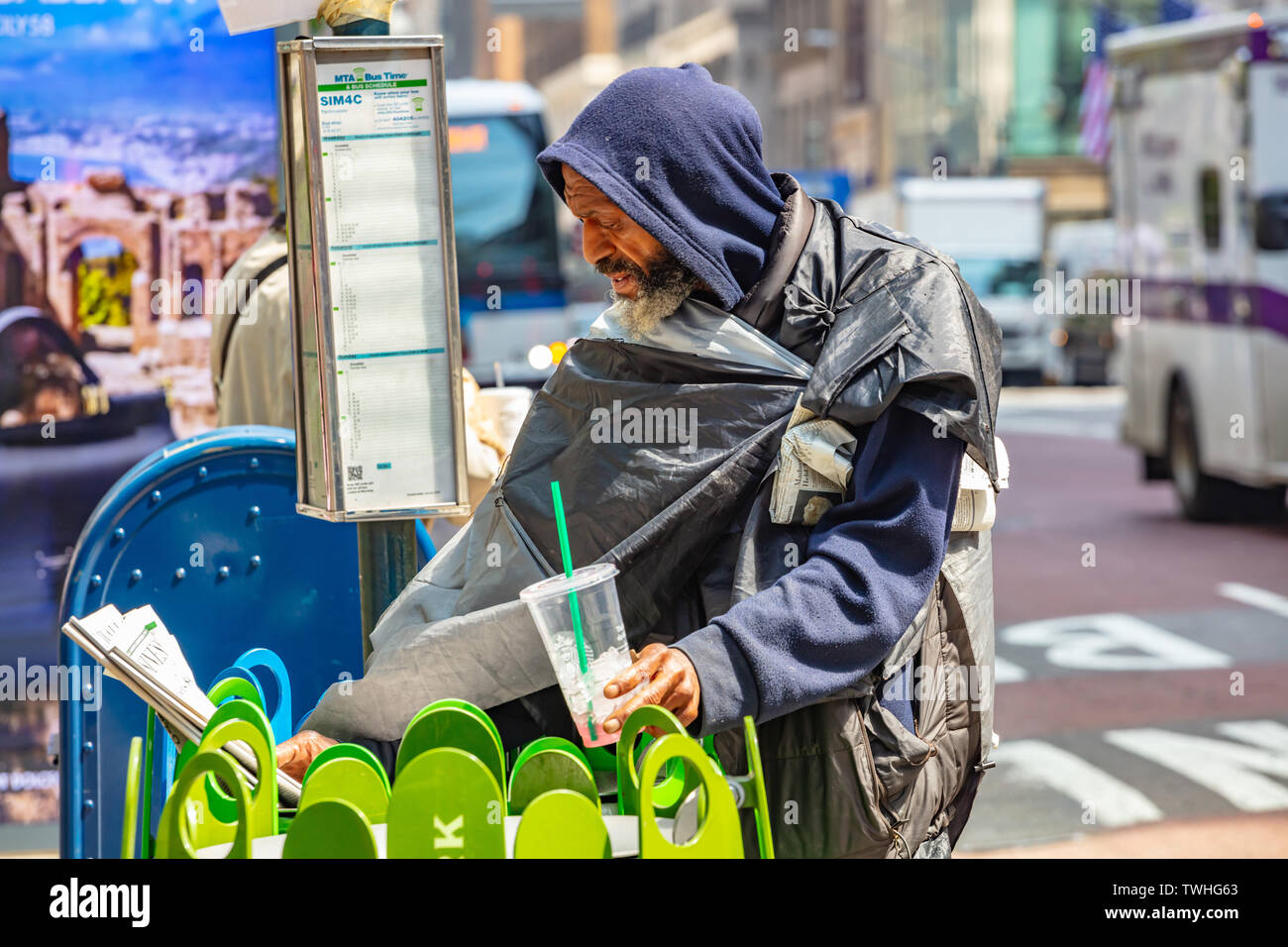 Homeless man searching in garbage hi-res stock photography and images ...