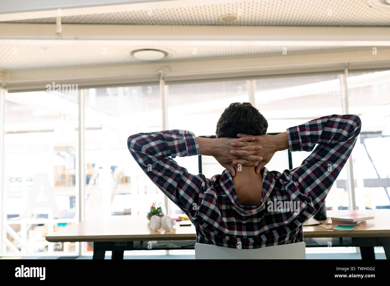 Man sitting on chair head in hands hi-res stock photography and images ...