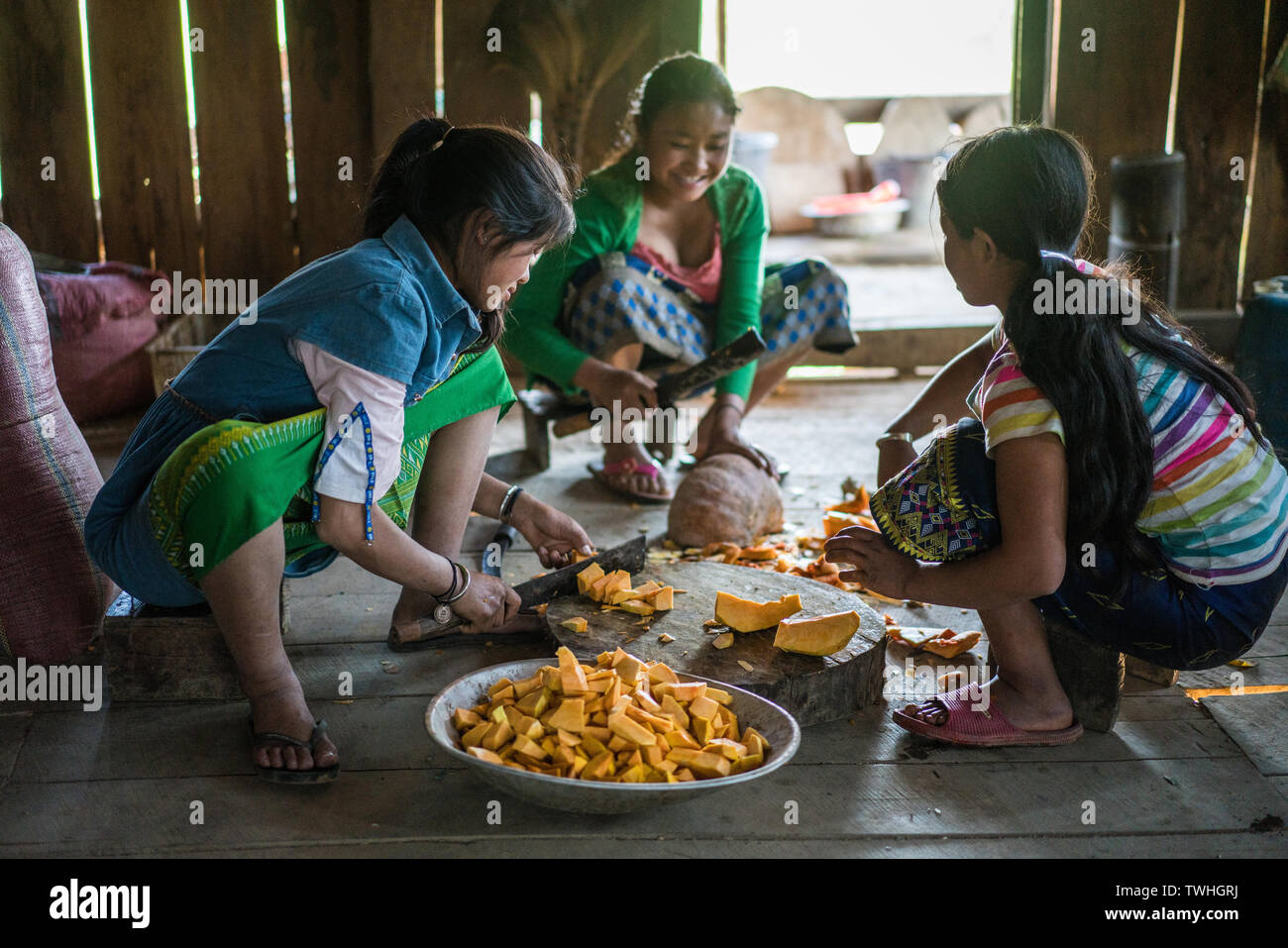 pig-slaughtering after shamanic ritual in the Akha village, Near ...