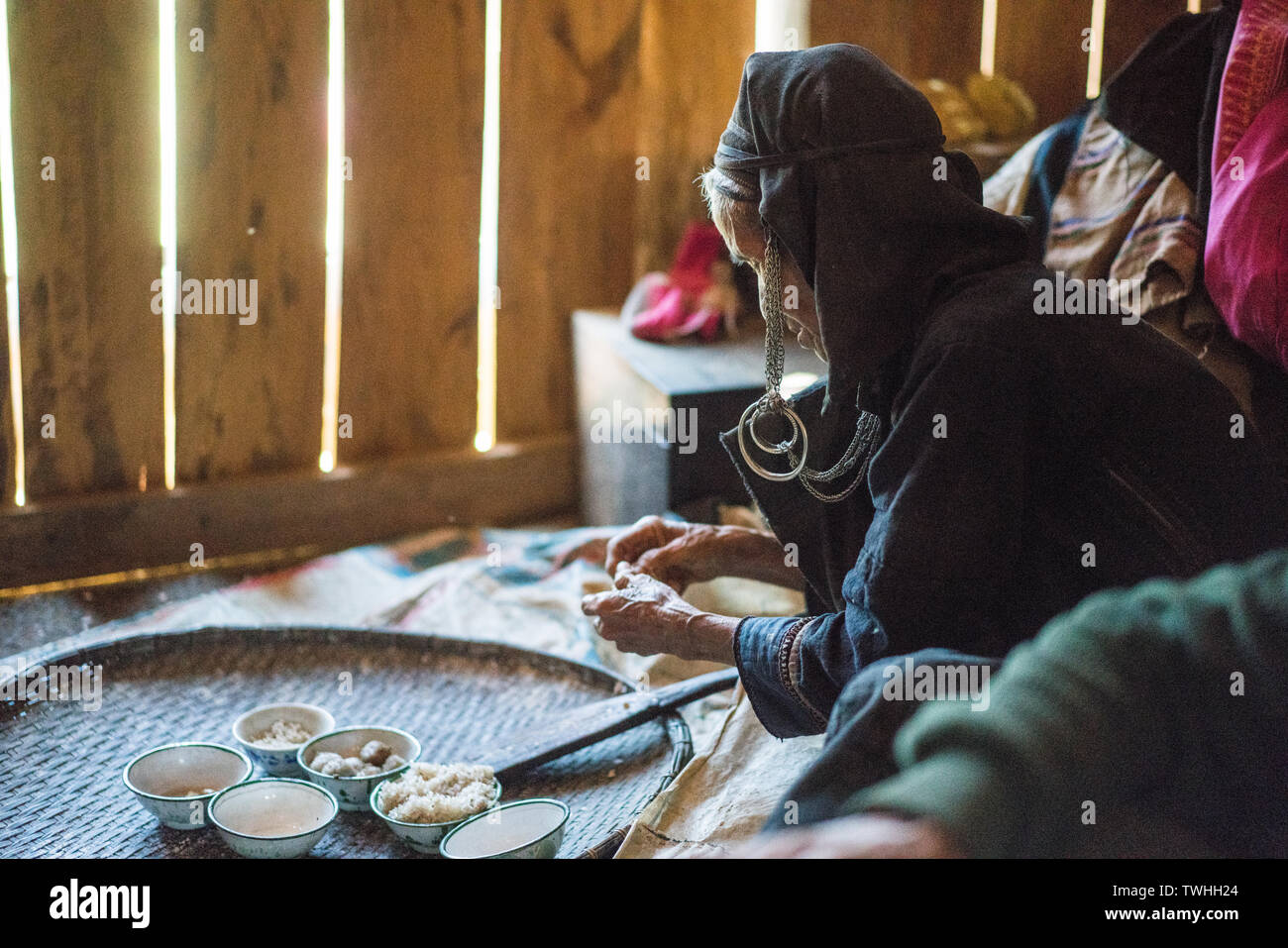 pig-slaughtering after shamanic ritual in the Akha village, Near ...