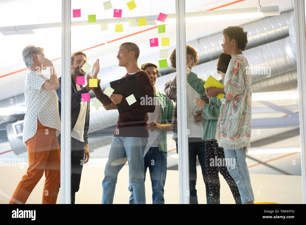 Business people discussing over sticky notes in the office Stock Photo ...