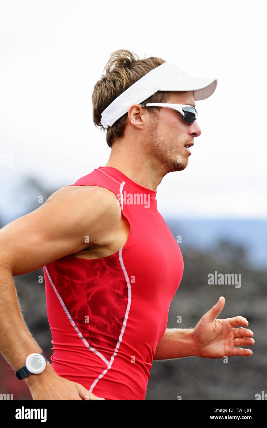 Running triathlon athlete man. Runner triathlete training for ironman ...