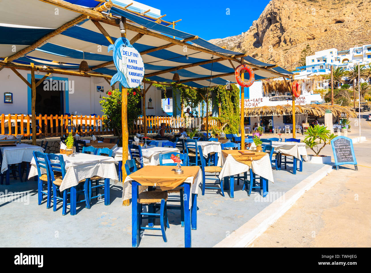 FINIKI PORT, KARPATHOS ISLAND - SEP 25, 2018: Typical Greek tavern in ...