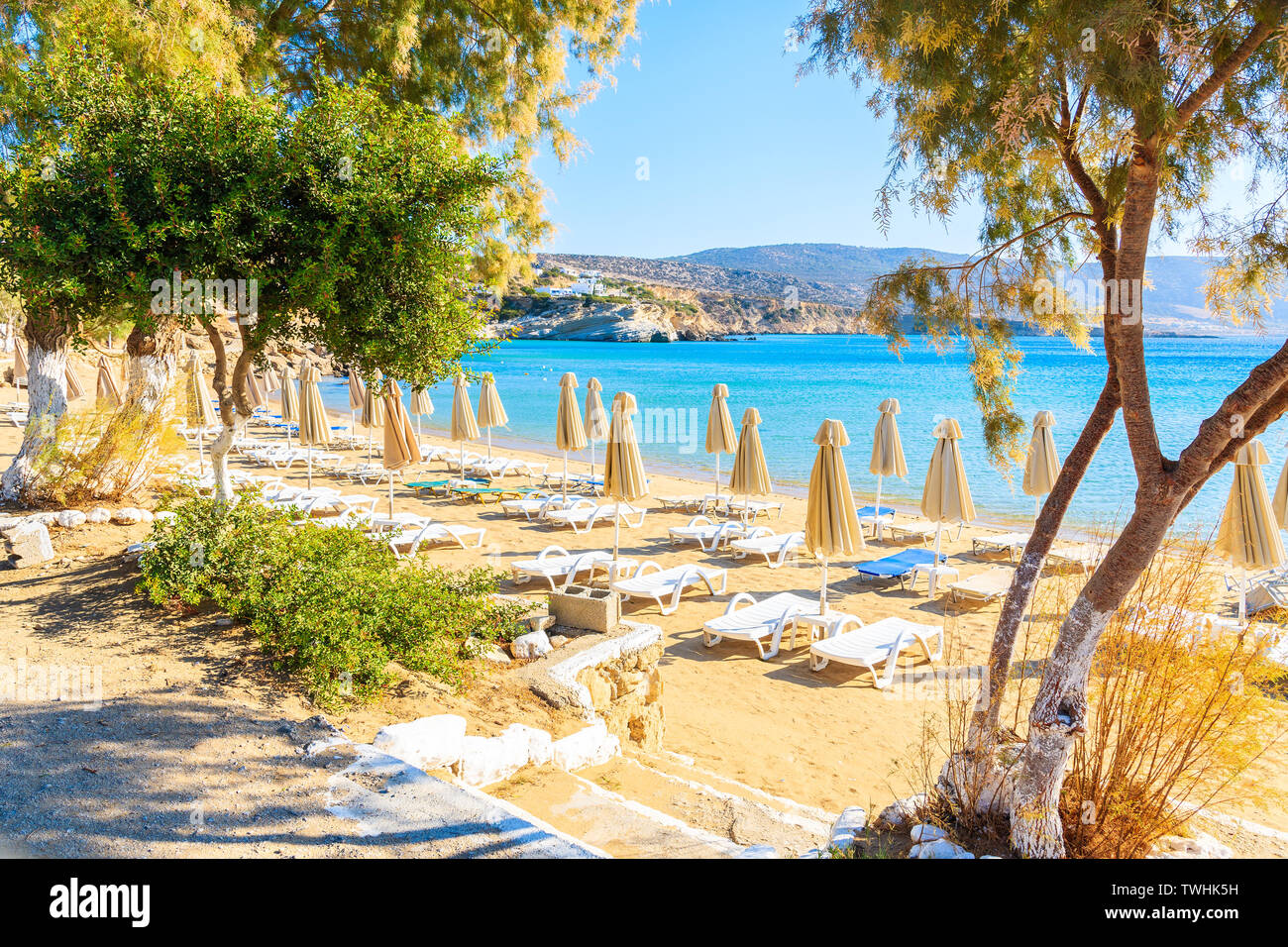 Umbrellas and chairs on beautiful Amopi beach, Karpathos island, Greece ...