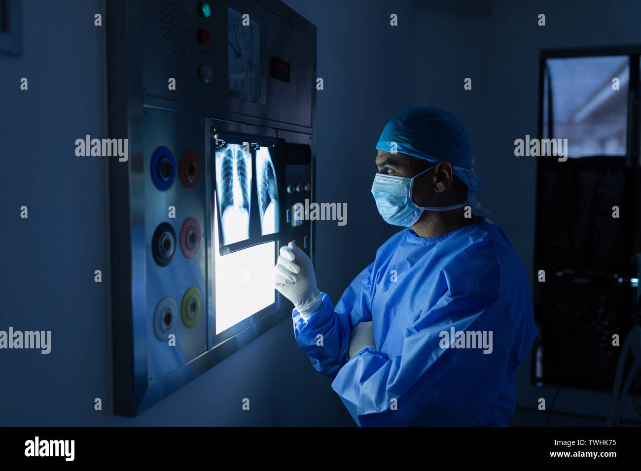Male surgeon reading x ray in operating room at hospital Stock Photo ...