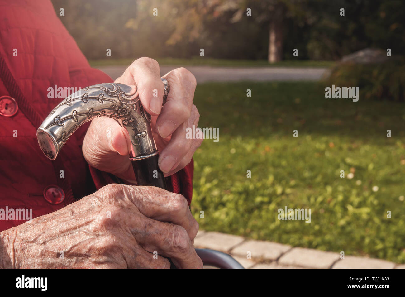 Old woman walking stick on hi-res stock photography and images - Alamy
