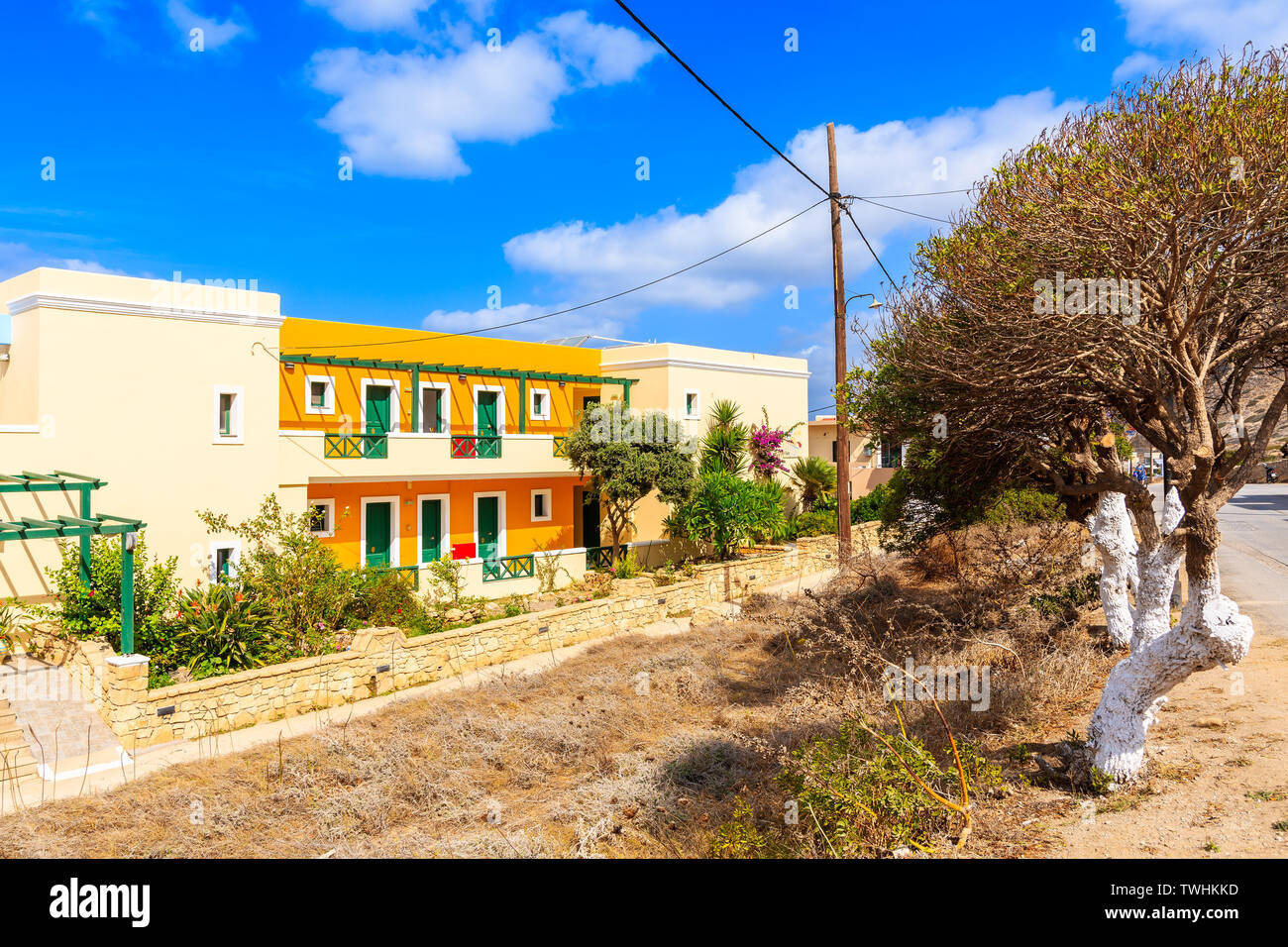 Colorful houses in Finiki village, Karpathos island, Greece Stock Photo ...