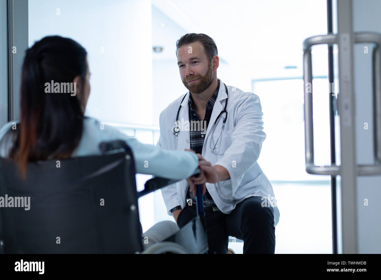 Doctor consoling women hi-res stock photography and images - Alamy