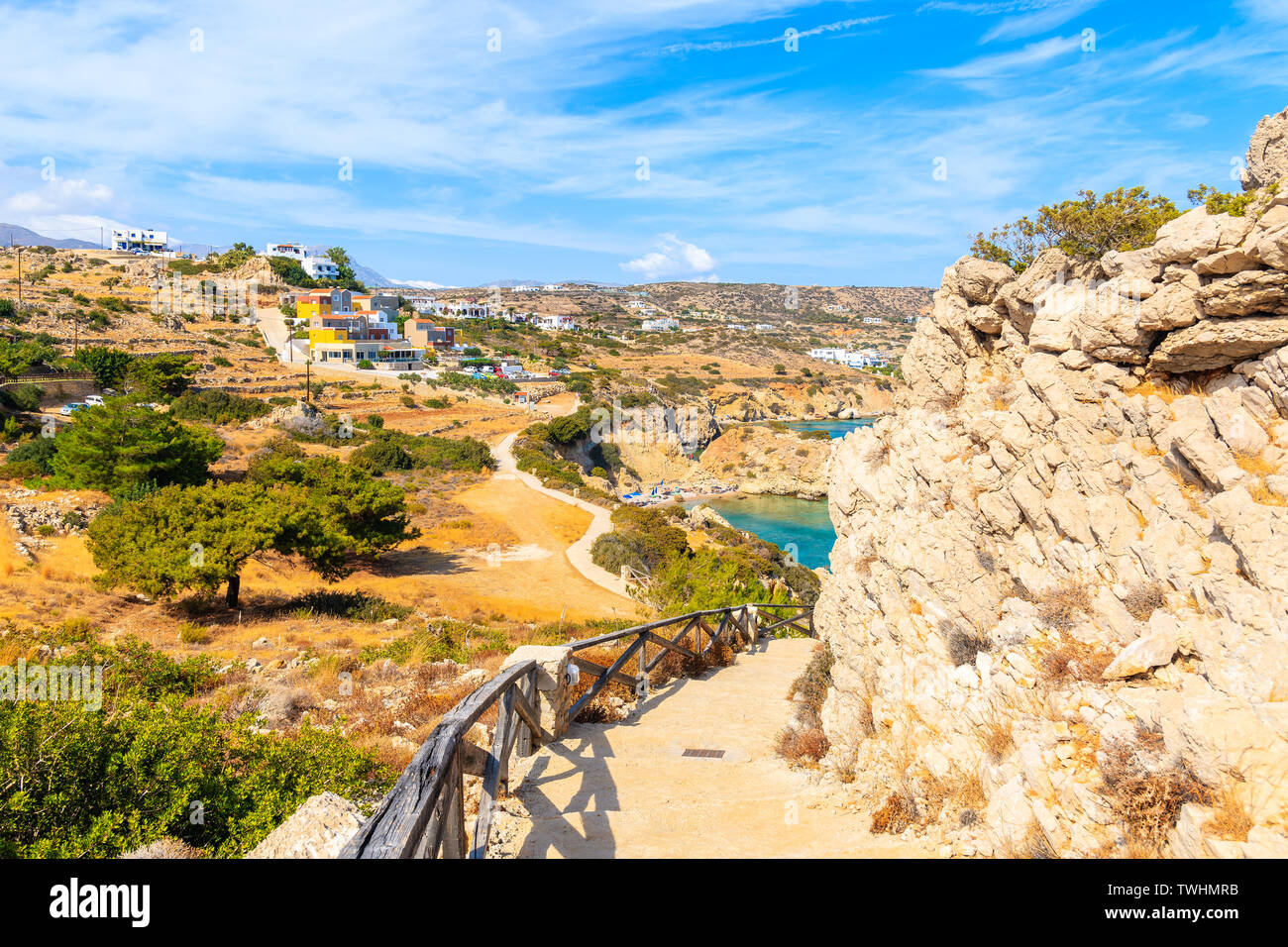 Coastal promenade along beautiful sea coast of Karpathos island near ...