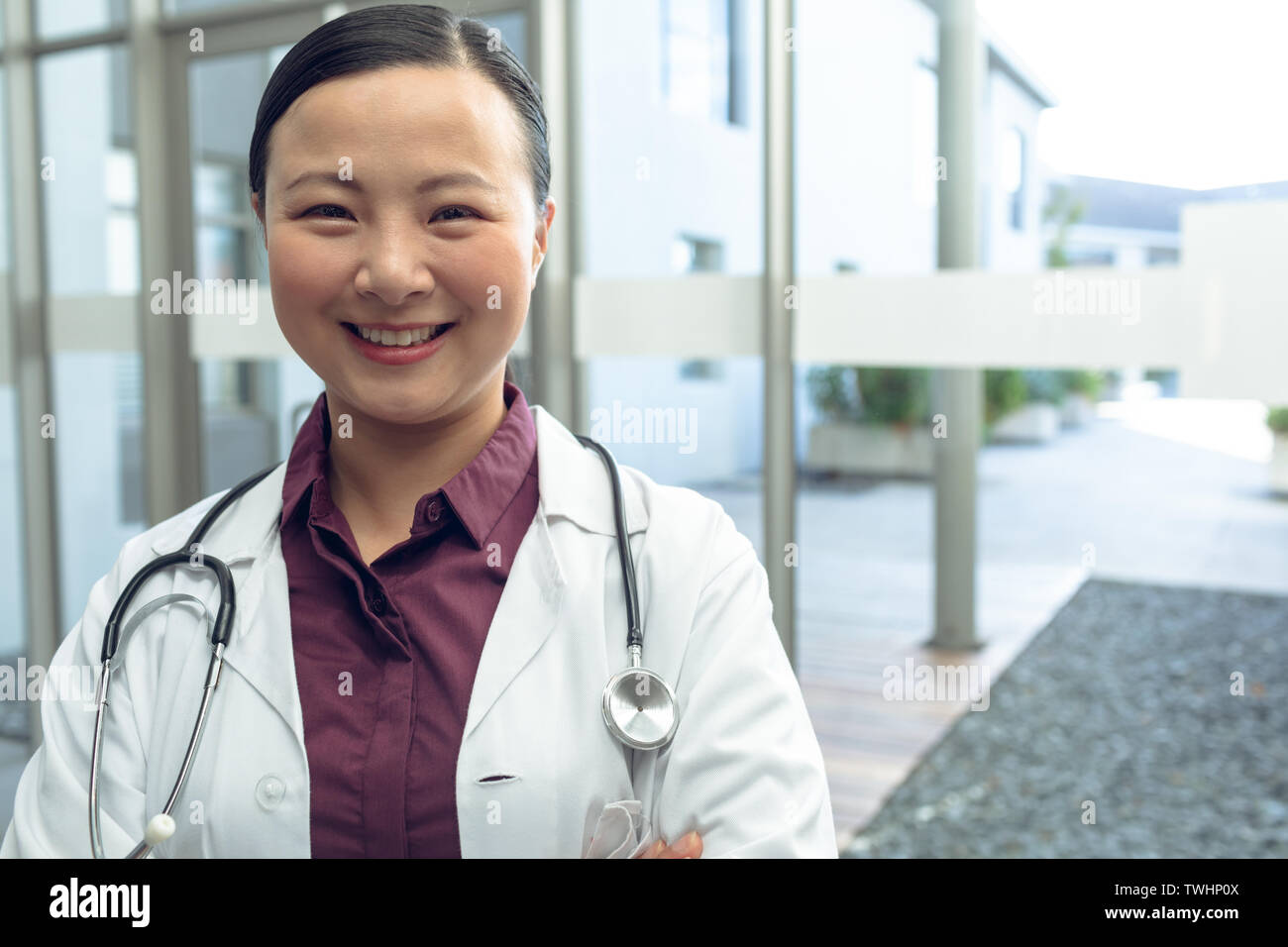 Female doctor looking at camera in the lobby of hospital Stock Photo ...