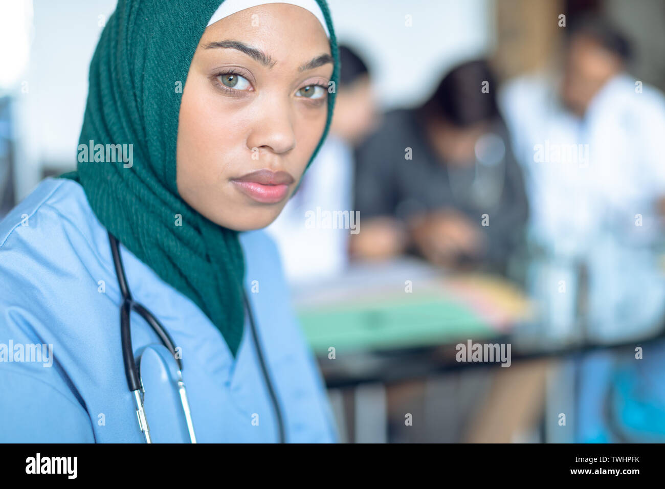 Female surgeon in hijab looking at camera in the hospital Stock Photo ...
