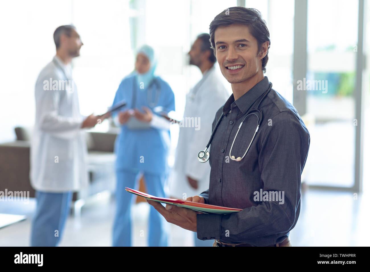 Doctor holding medical file hi-res stock photography and images - Alamy
