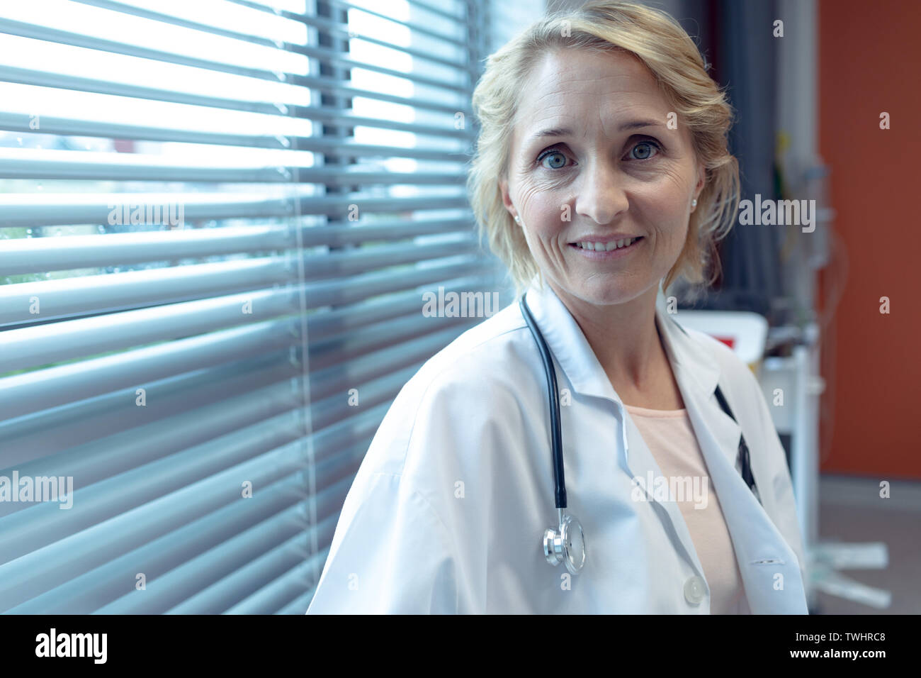 Female doctor smiling in the hospital Stock Photo - Alamy