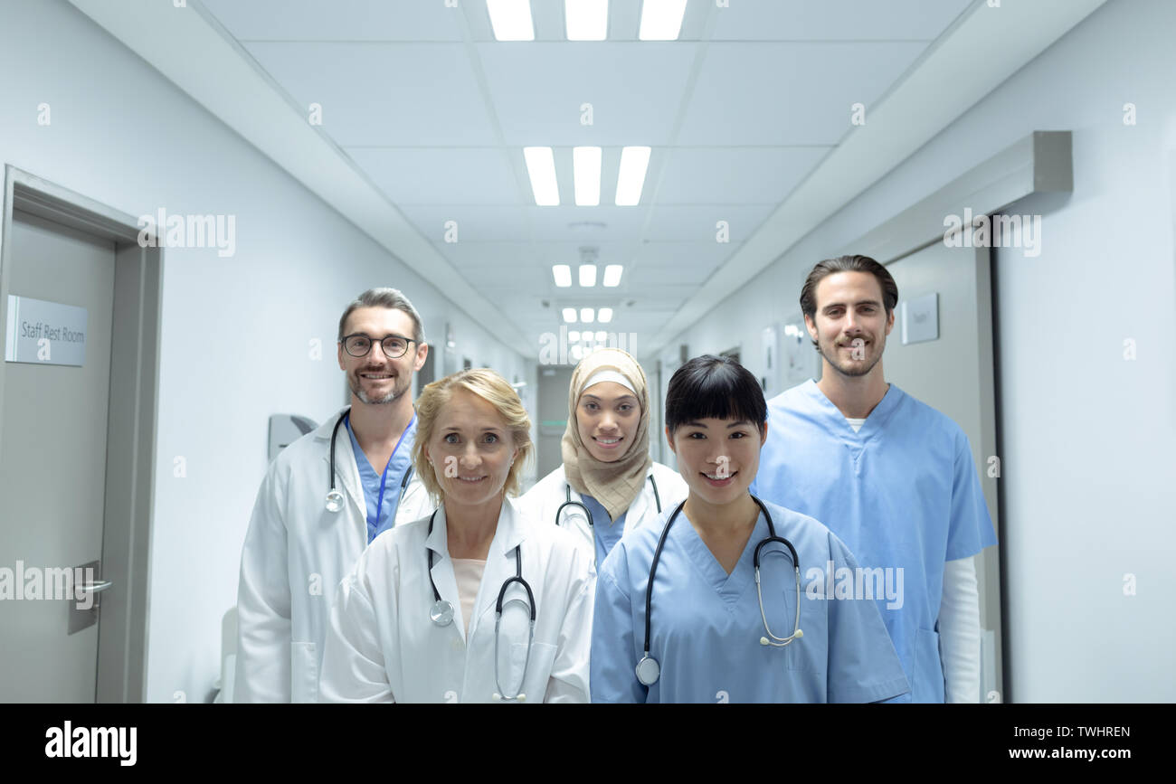 Medical teams standing with arms crossed in the corridor at hospital ...